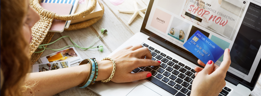 Woman at laptop making a purchase online with her credit card